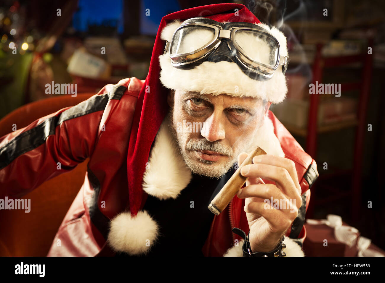 Portrait of Bad Santa smoking a cigar Stock Photo - Alamy
