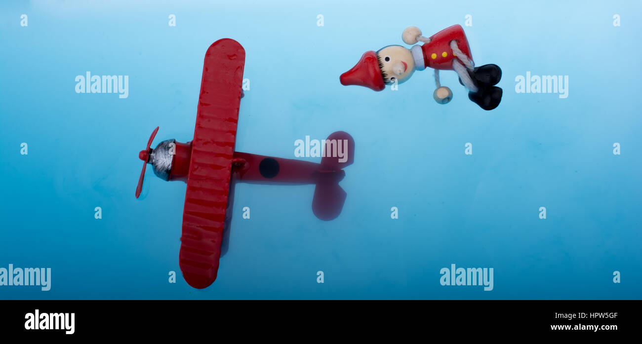 Pinocchio and a model airplane in water Stock Photo - Alamy