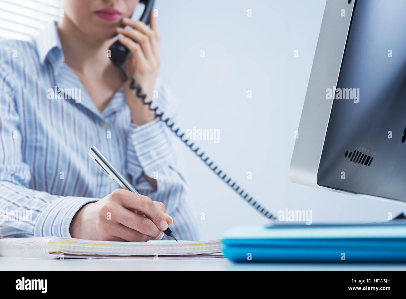Phone call writing paperwork hi-res stock photography and images - Alamy