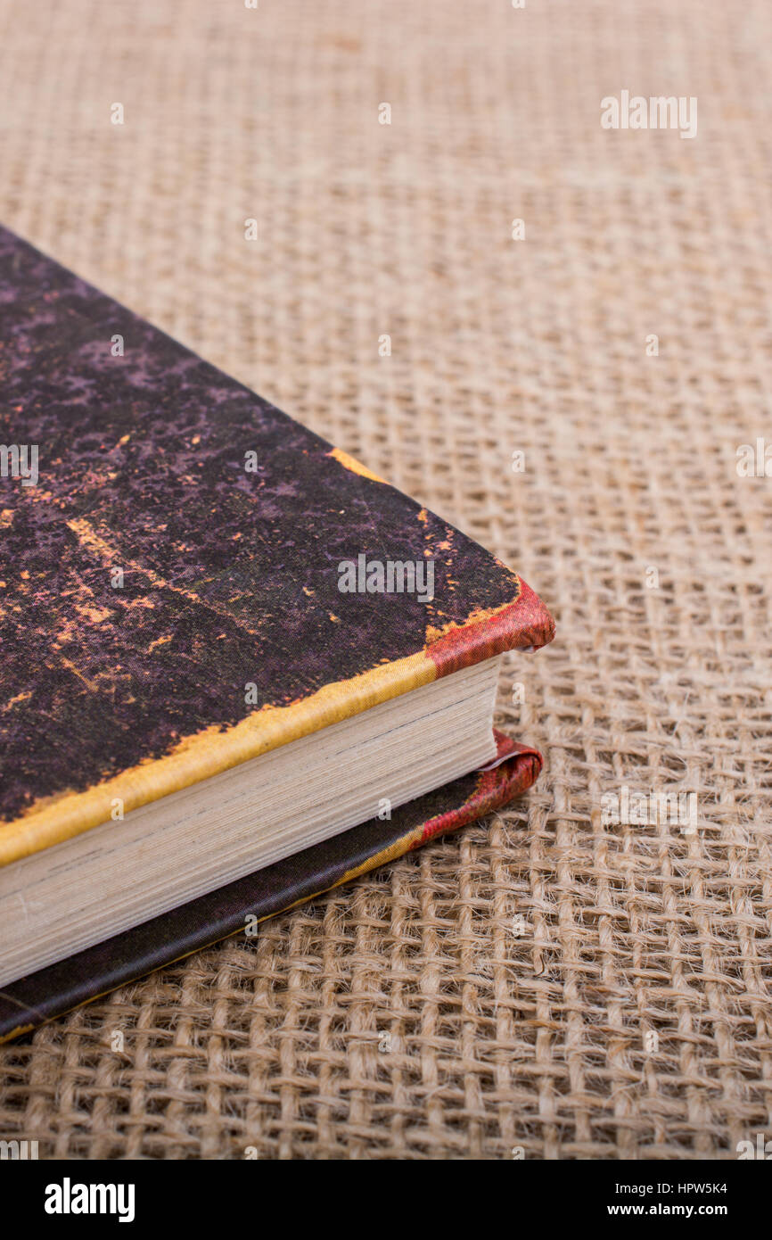 Book pages partly in view on white background Stock Photo - Alamy