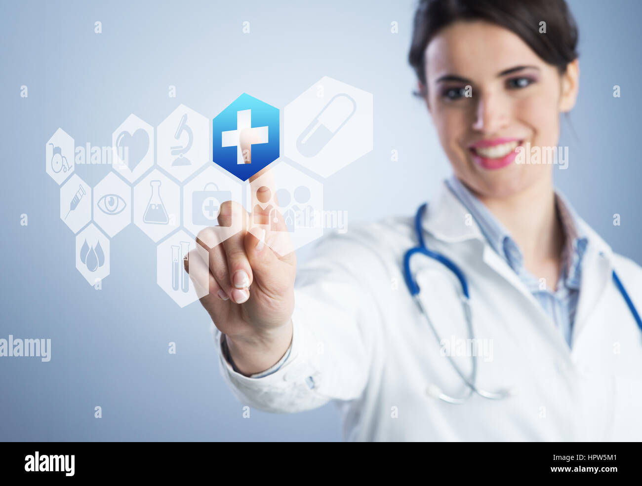 Young female doctor using a touch screen interface Stock Photo - Alamy