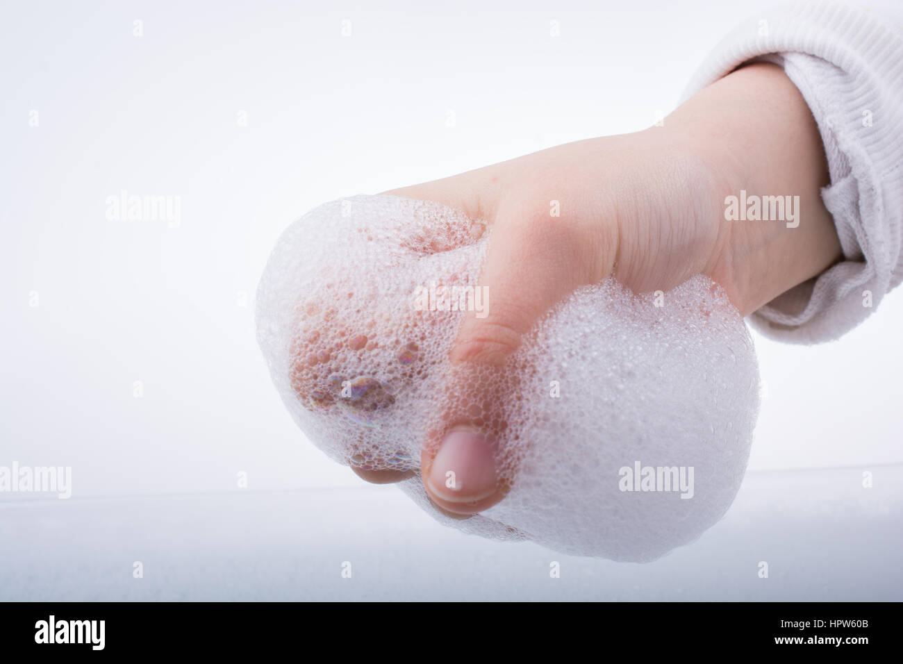 Hand washing and soap foam on a foamy background Stock Photo - Alamy