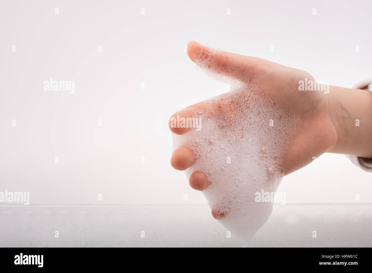 Hand washing and soap foam on a foamy background Stock Photo - Alamy