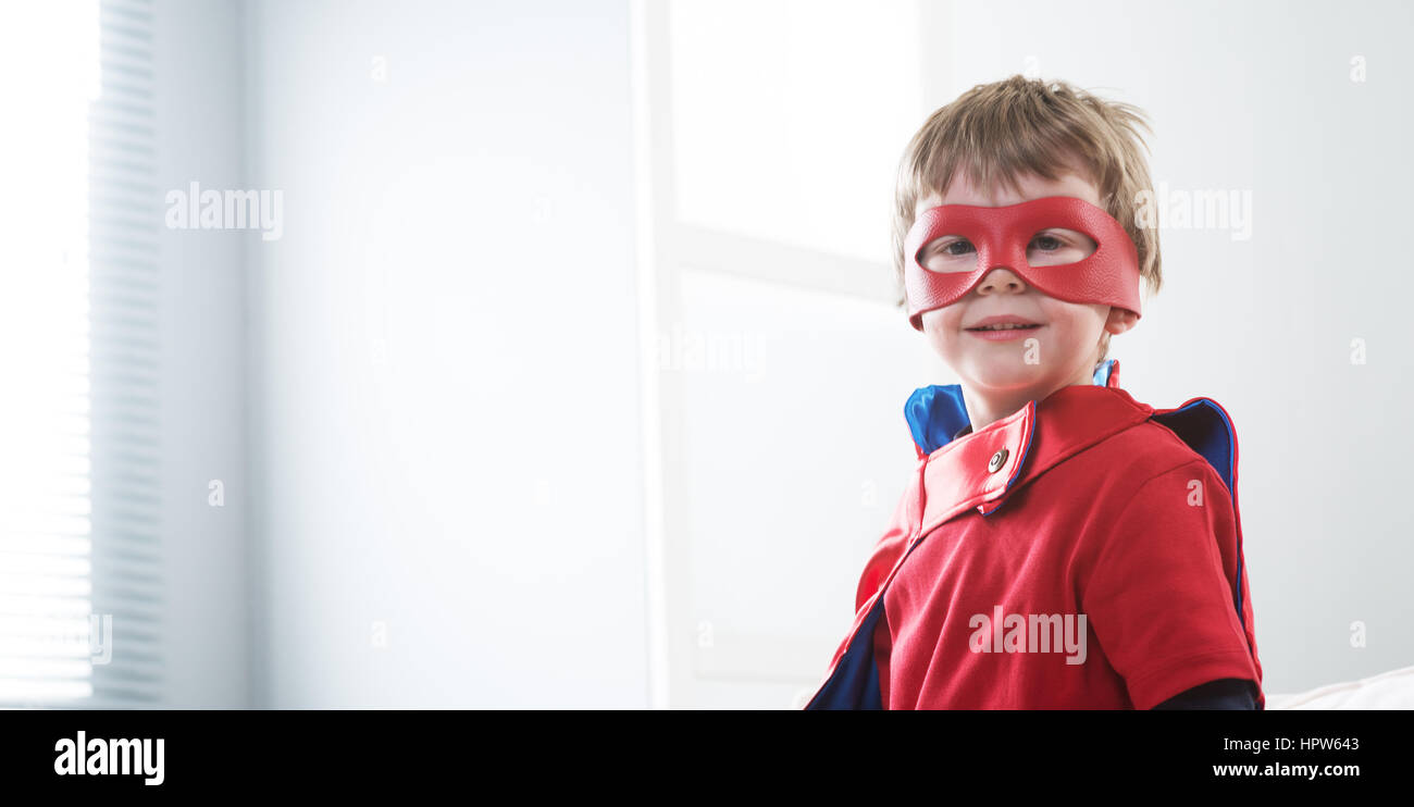 Smiling super hero kid at home looking at camera Stock Photo - Alamy