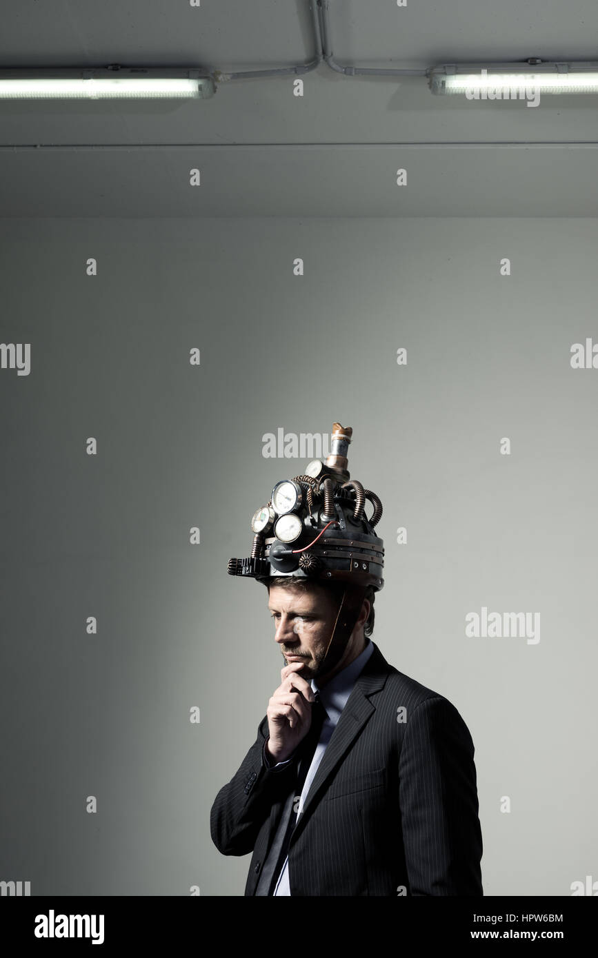 Confident businessman thinking with hand on chin wearing steampunk ...