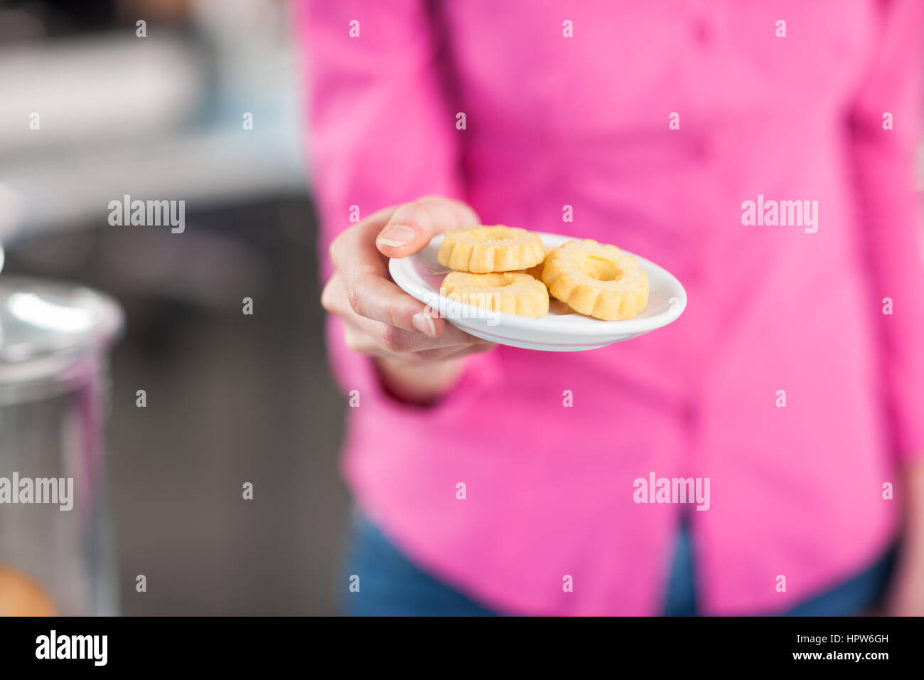 Waitress serving a dish with butter cookies, hands close up Stock Photo ...