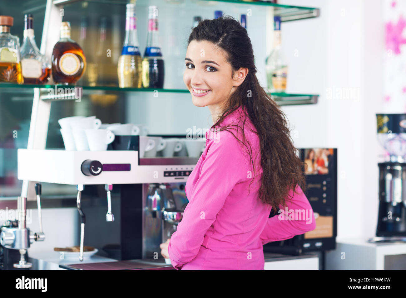Female barista making coffee with an espresso coffee machine Stock ...