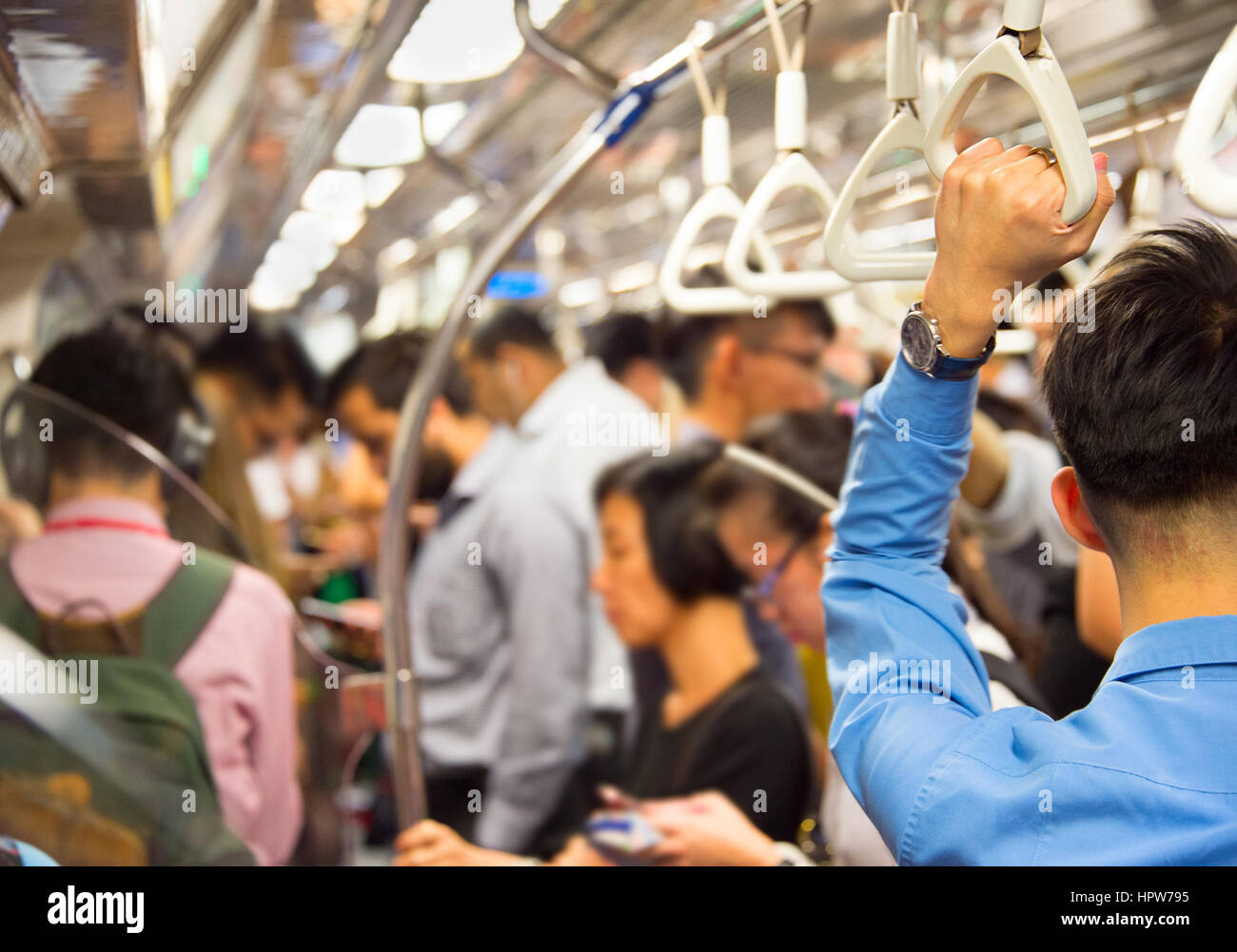 People inside the crowded metro train. Singapore Stock Photo - Alamy