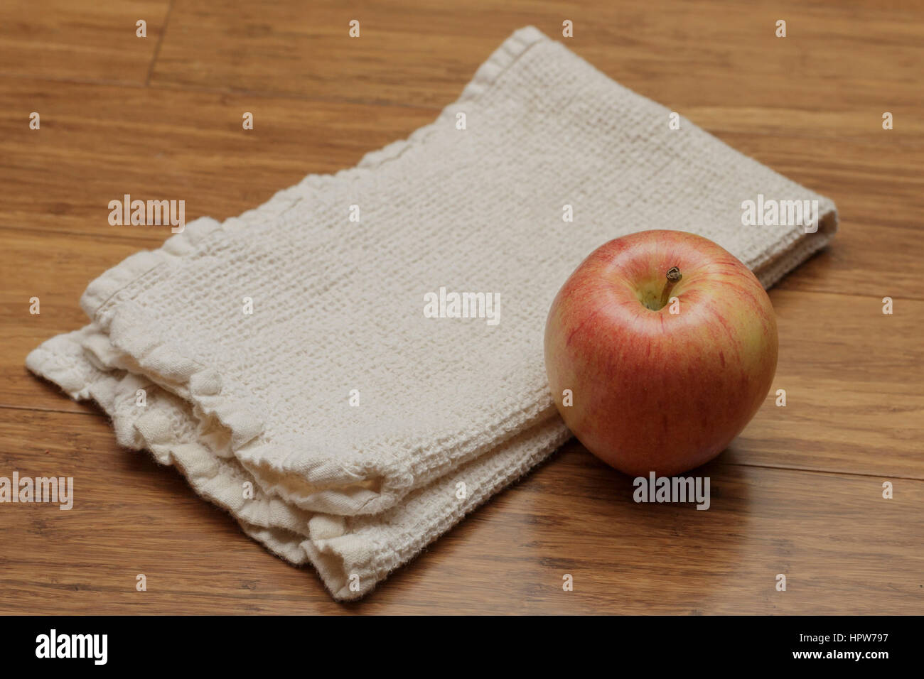 isolated apple with cloth on wooden background Stock Photo - Alamy
