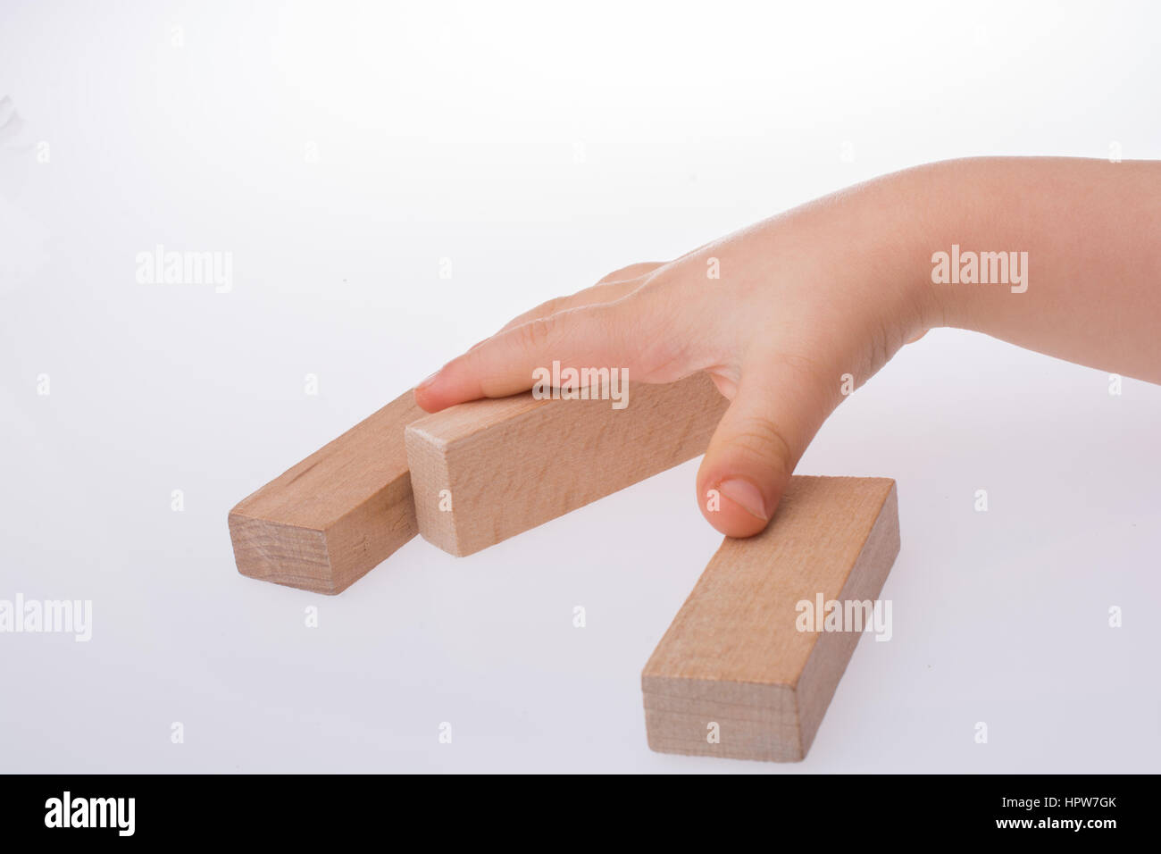 Child playing with building blocks on white background Stock Photo - Alamy