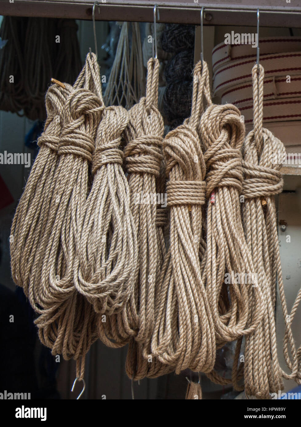 Bundle of linen rope in a market place Stock Photo - Alamy