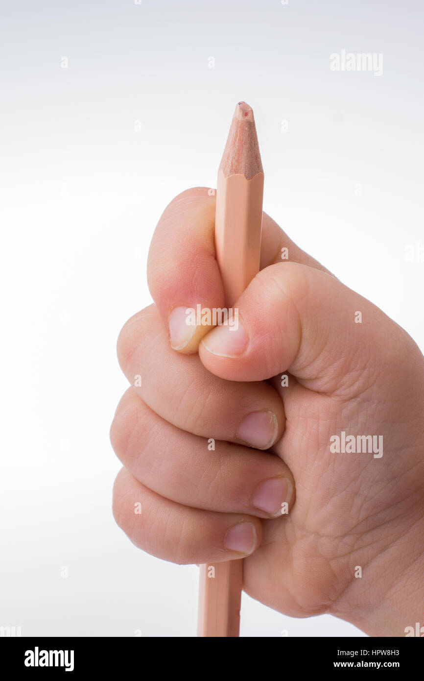 Hand holding a color pencil on a white background Stock Photo - Alamy