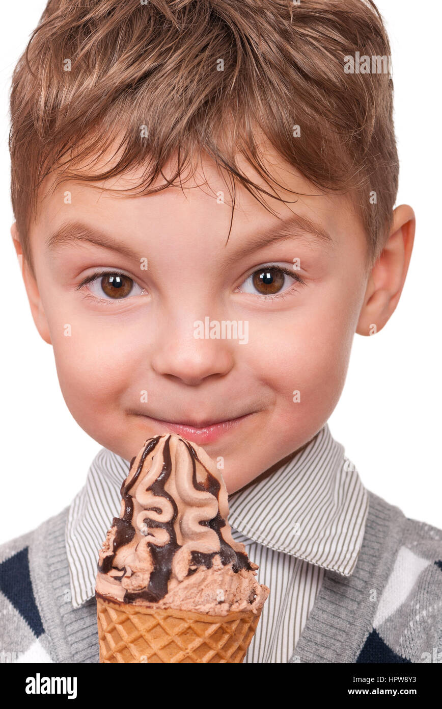 Portrait of cheerful little boy with ice cream cone. Close-up of child ...