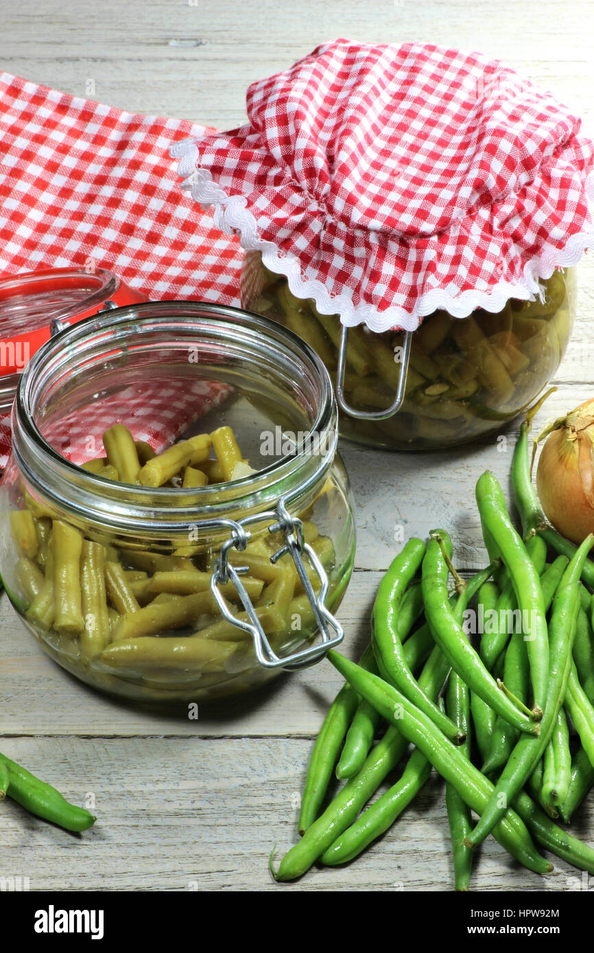 home canned green beans on wooden table Stock Photo - Alamy