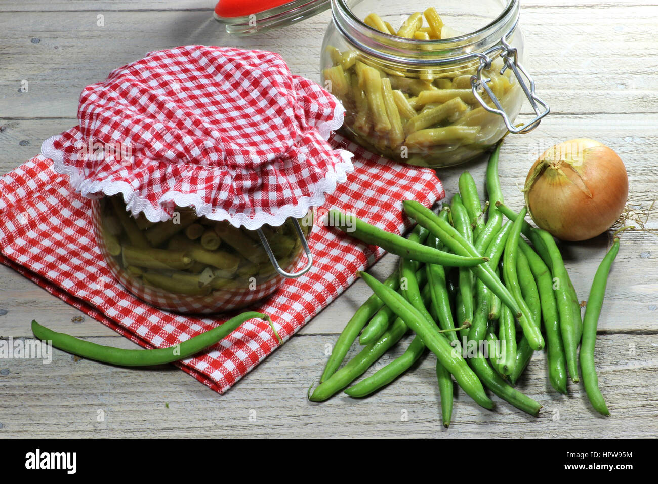 home canned green beans on wooden table Stock Photo - Alamy