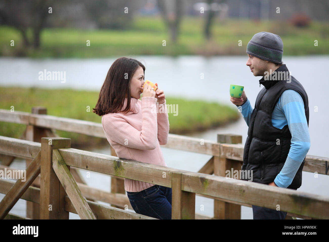 Couple are having cold morning hot coffee outside Stock Photo - Alamy