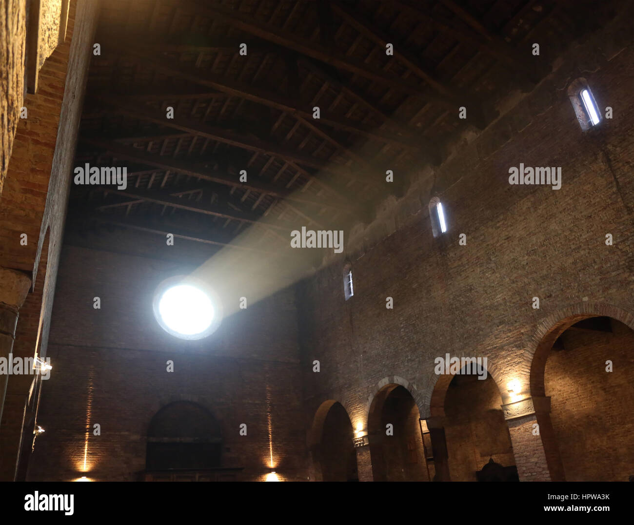 beam of light that penetrates from the rose window into an ancient ...