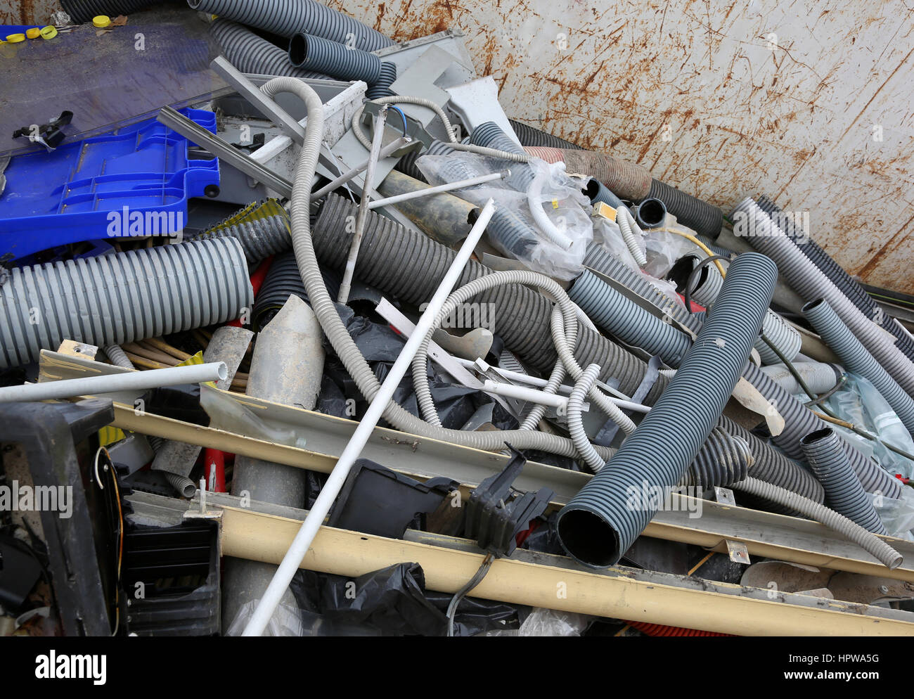 plastic pipes and recyclable material broken in a refuse collection ...