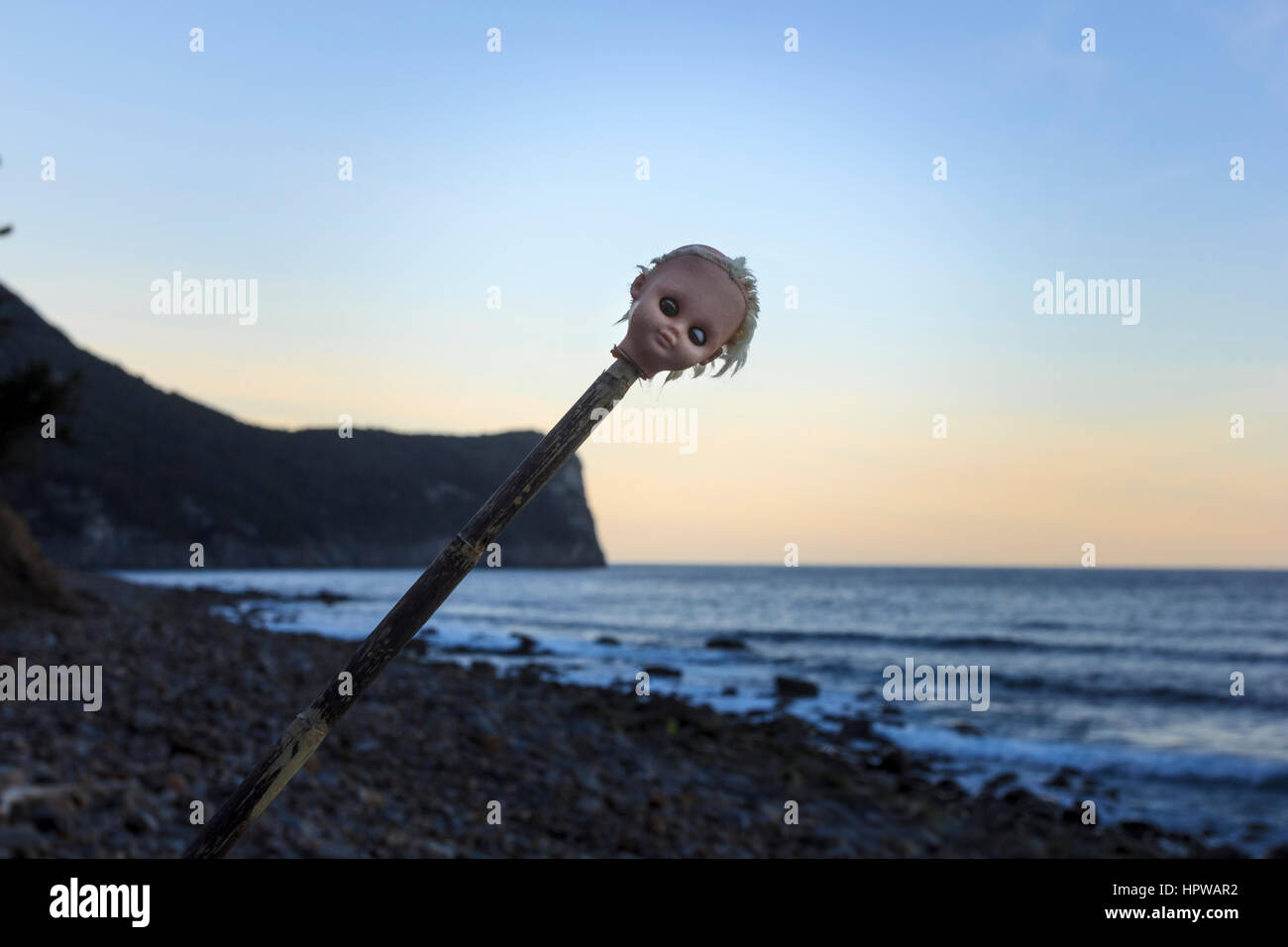 doll head on the coast Stock Photo - Alamy
