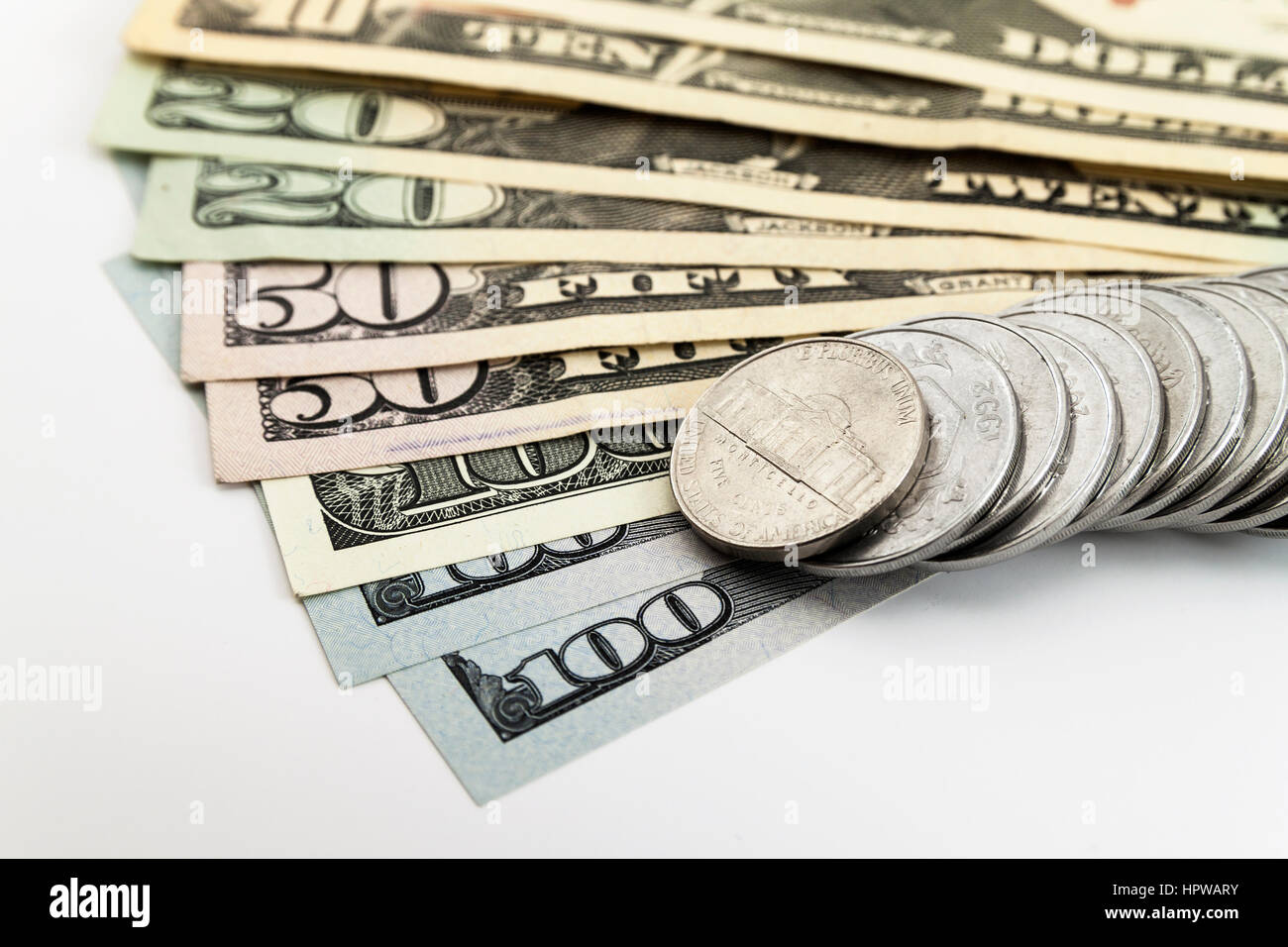 US american dollar money bills and coins cents spread on white ...