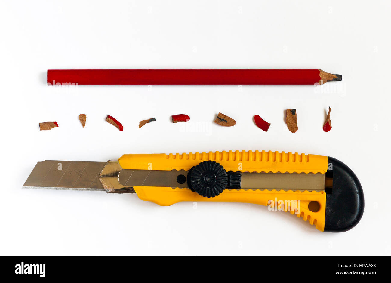 Pencil with cutter knife with shavings, on blank white sheet of paper ...