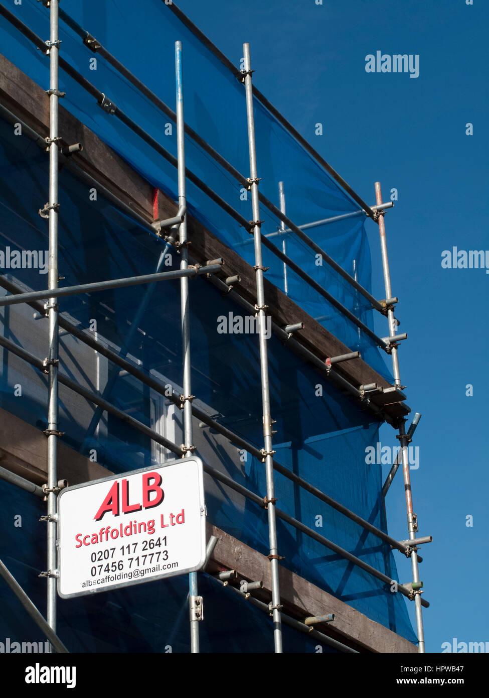 Building site scaffold and sign over W H Smith retail unit with safety ...