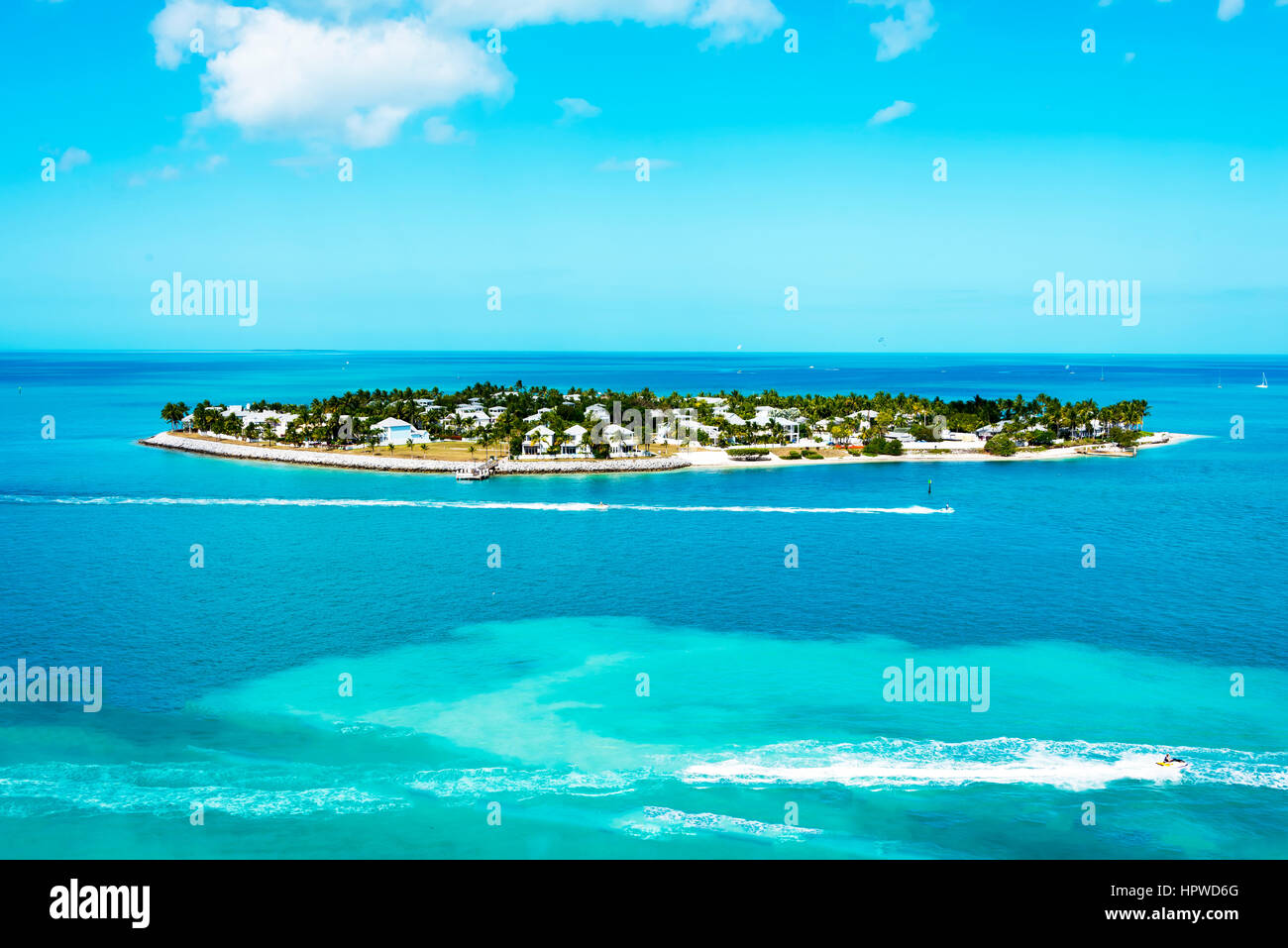 Isolated island off the coast of Key West surrounded by blue ocean ...