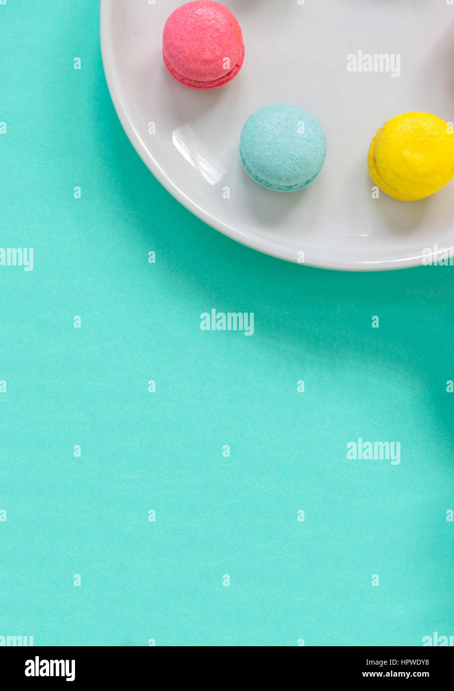 A colorful macaron- french dessert ,closeup and focused blue macaron ...