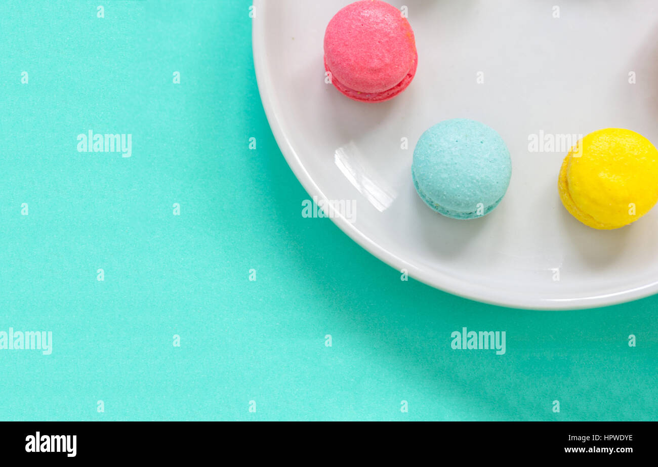 A colorful macaron- french dessert ,closeup and focused blue macaron ...