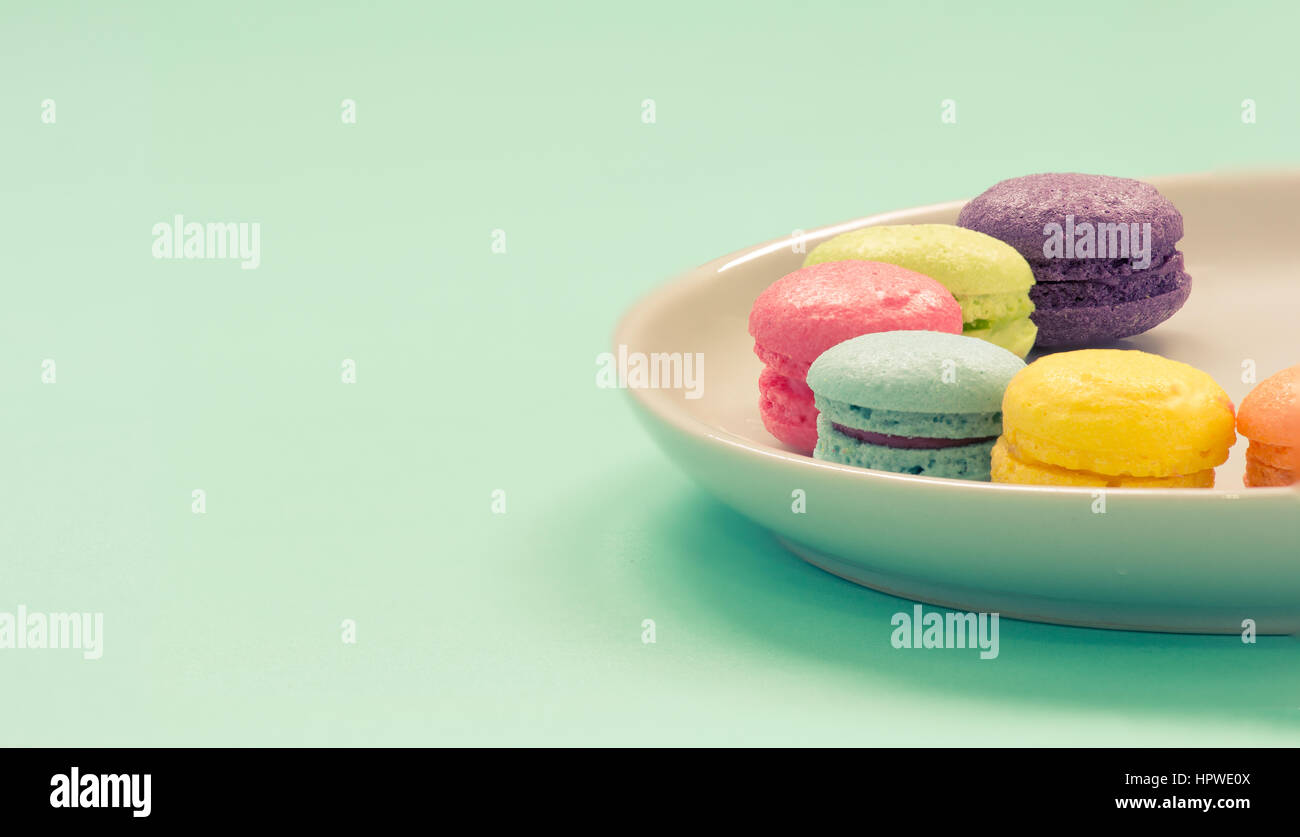 A colorful macaron- french dessert ,closeup and focused blue macaron ...