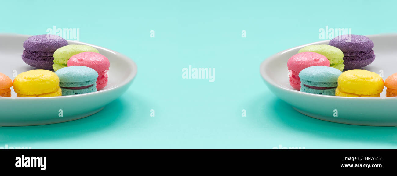 A colorful macaron- french dessert ,closeup and focused blue macaron ...