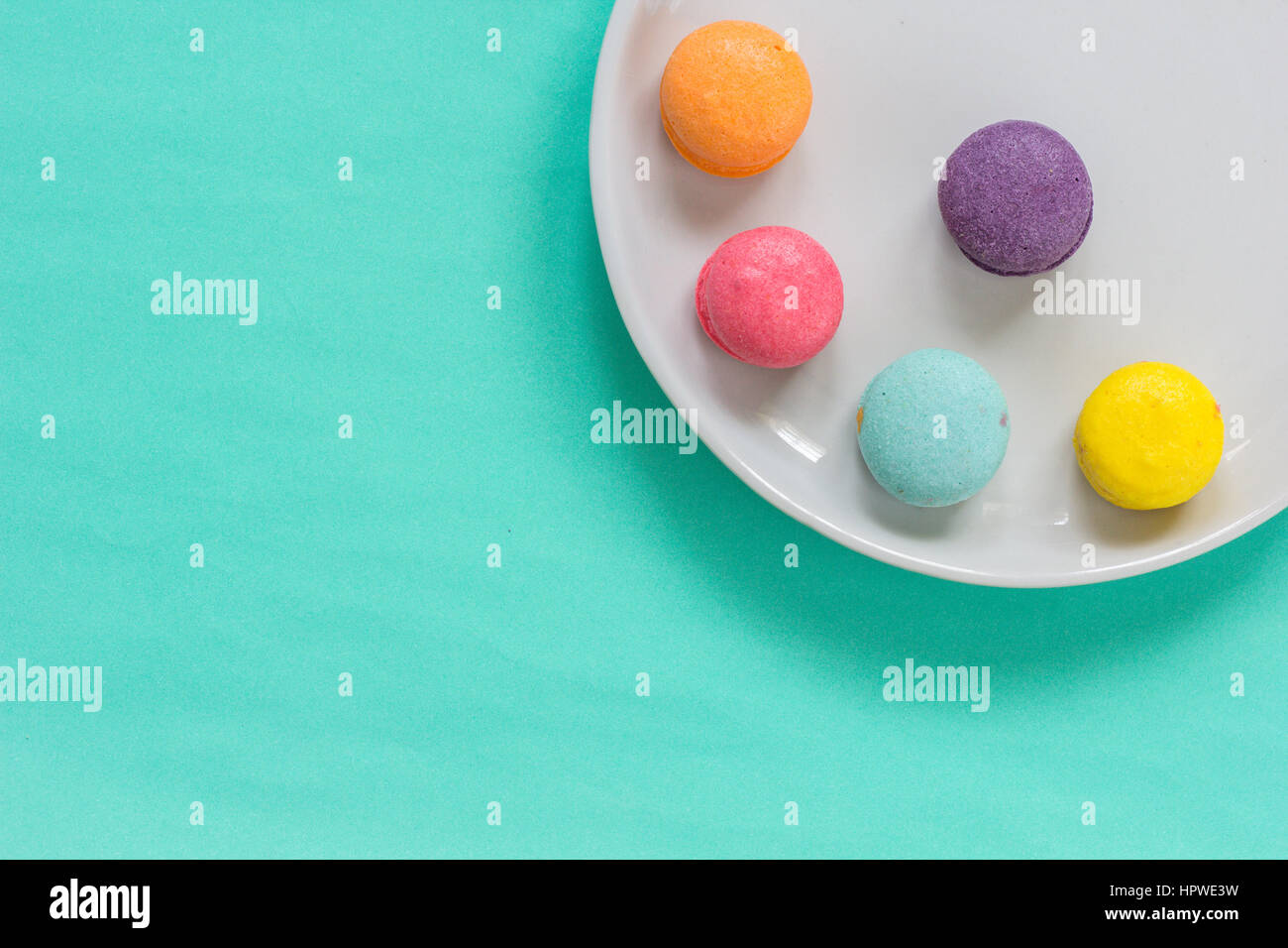 A colorful macaron- french dessert ,closeup and focused blue macaron ...
