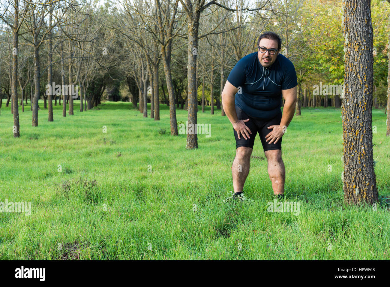 Abstract and conceptual tired, tired man in the woods. Man weighed down ...