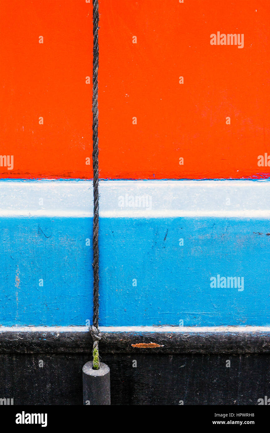 Red, white and blue horizontal stripes on the painted hull of a canal ...