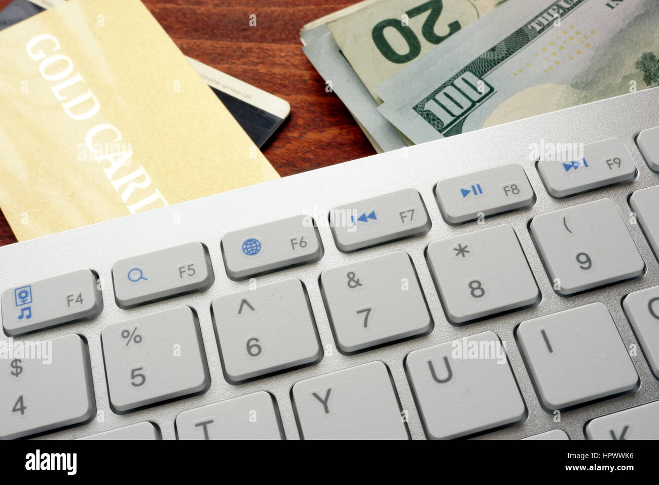 Keyboard, credit card and cash Stock Photo - Alamy