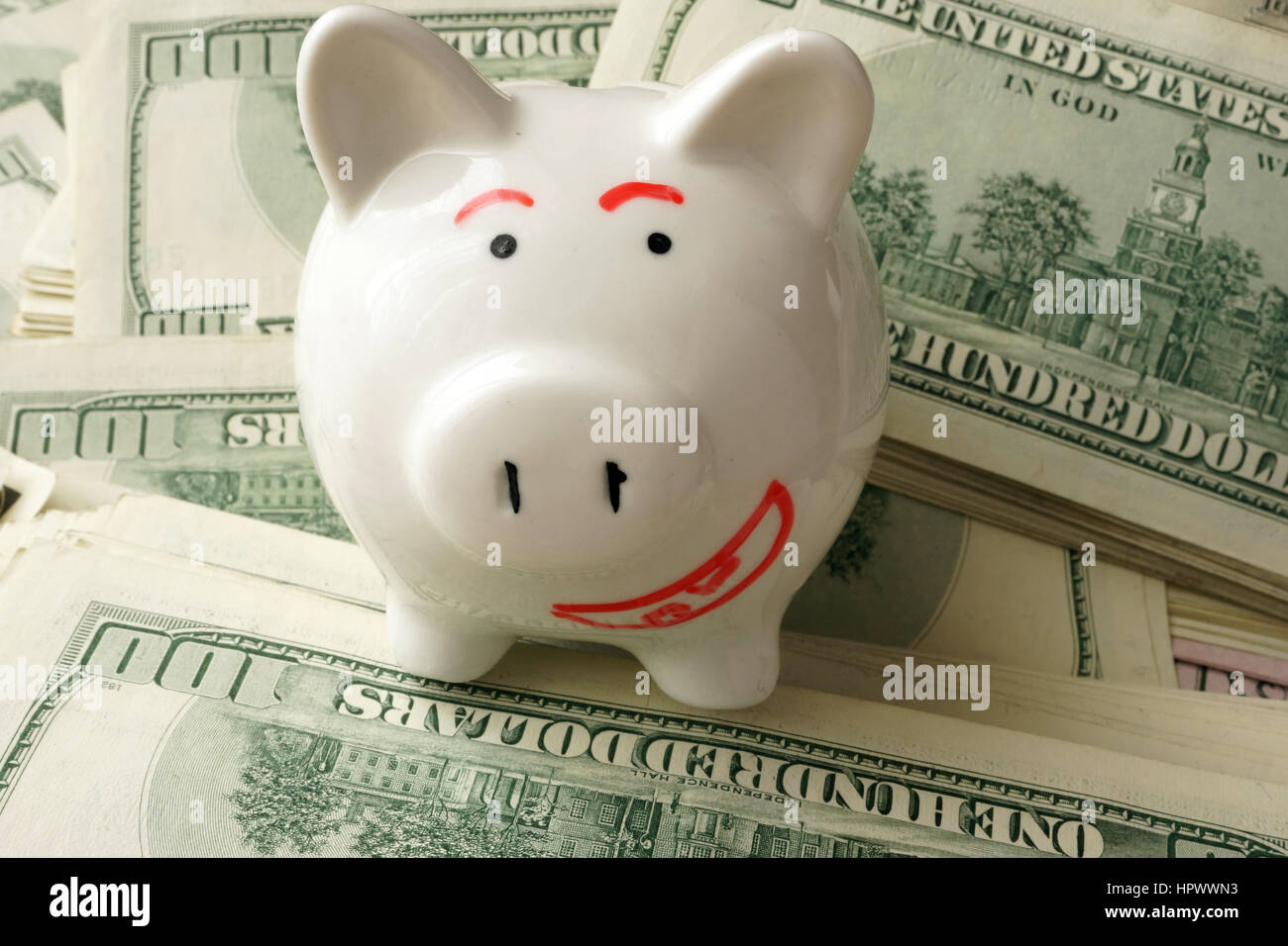 Savings concept. Piggy bank with smile and cash Stock Photo - Alamy