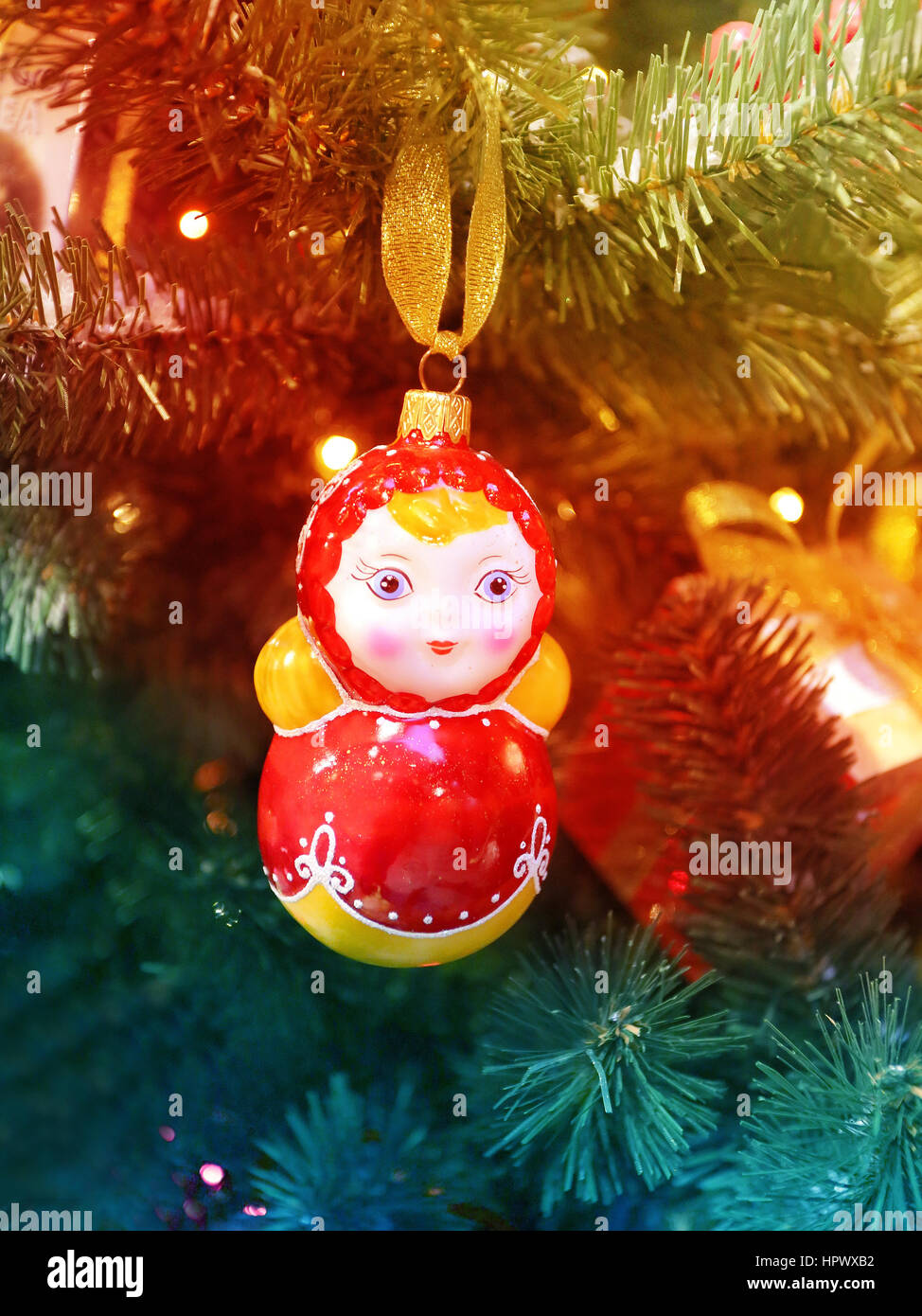 Beautiful Russian toy matryoshka photographed closeup on the Christmas ...