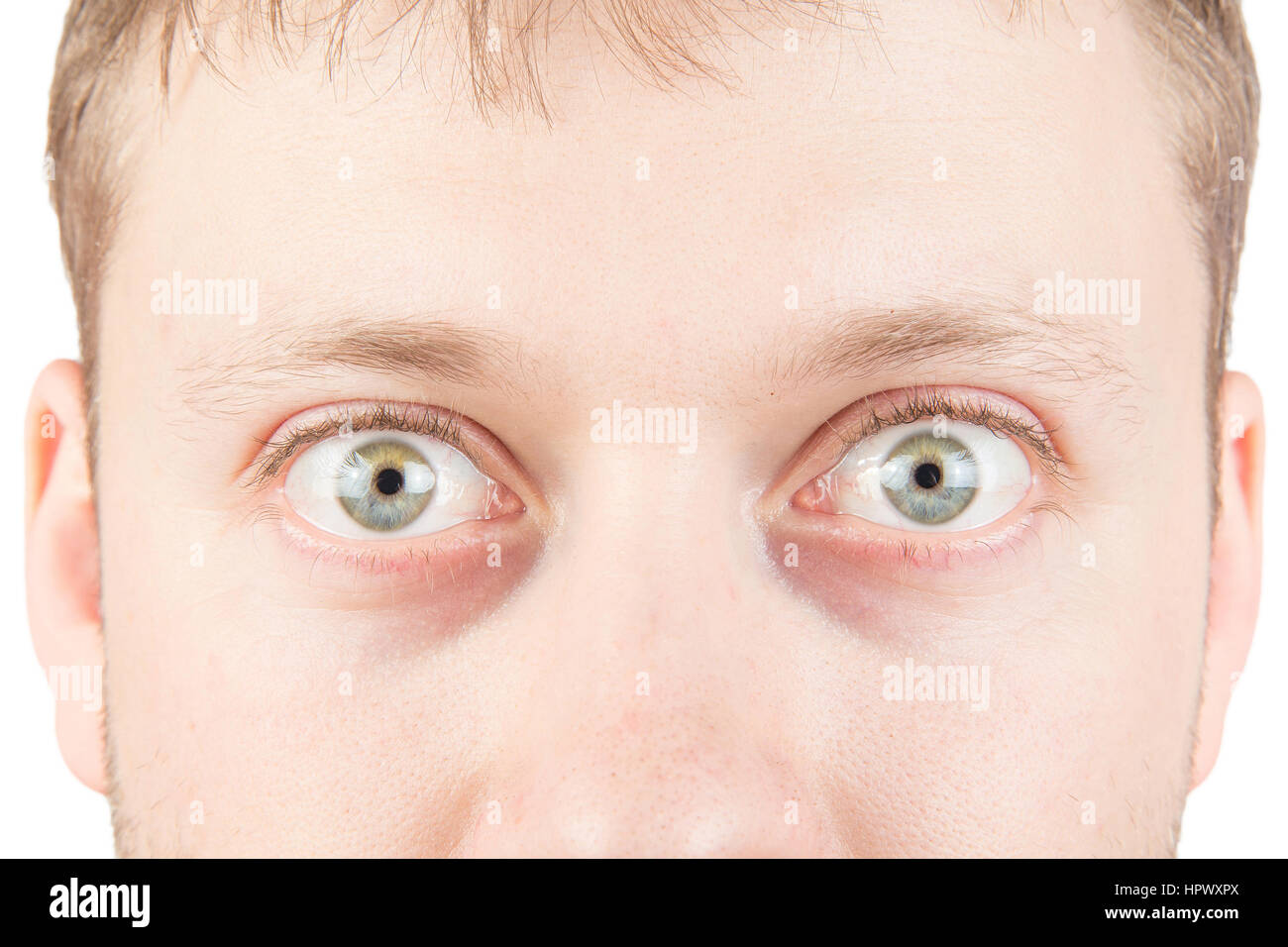 Man's surprised eyes isolated on white close up Stock Photo - Alamy