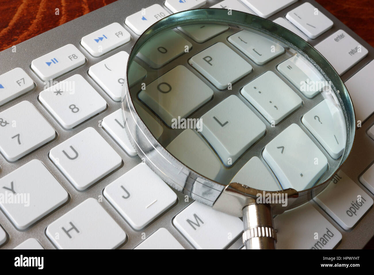 Magnifier and keyboard. Concept of search and audit Stock Photo - Alamy