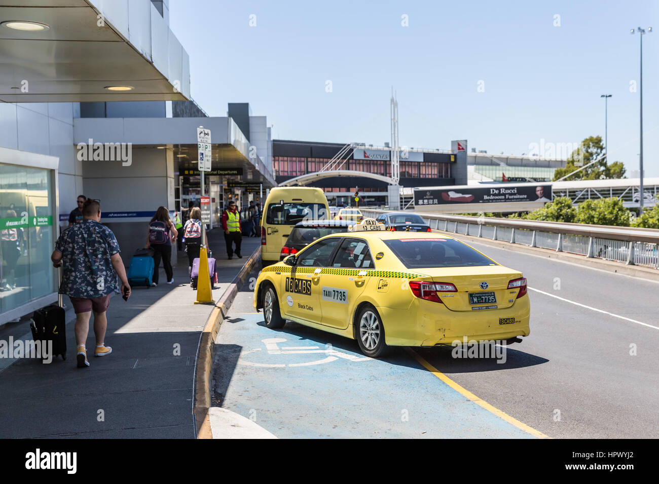 A taxi arrives at Airport Terminal to deliver passengers Stock Photo ...