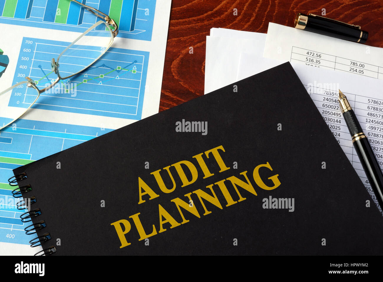 Book with title Audit planning on a table Stock Photo - Alamy