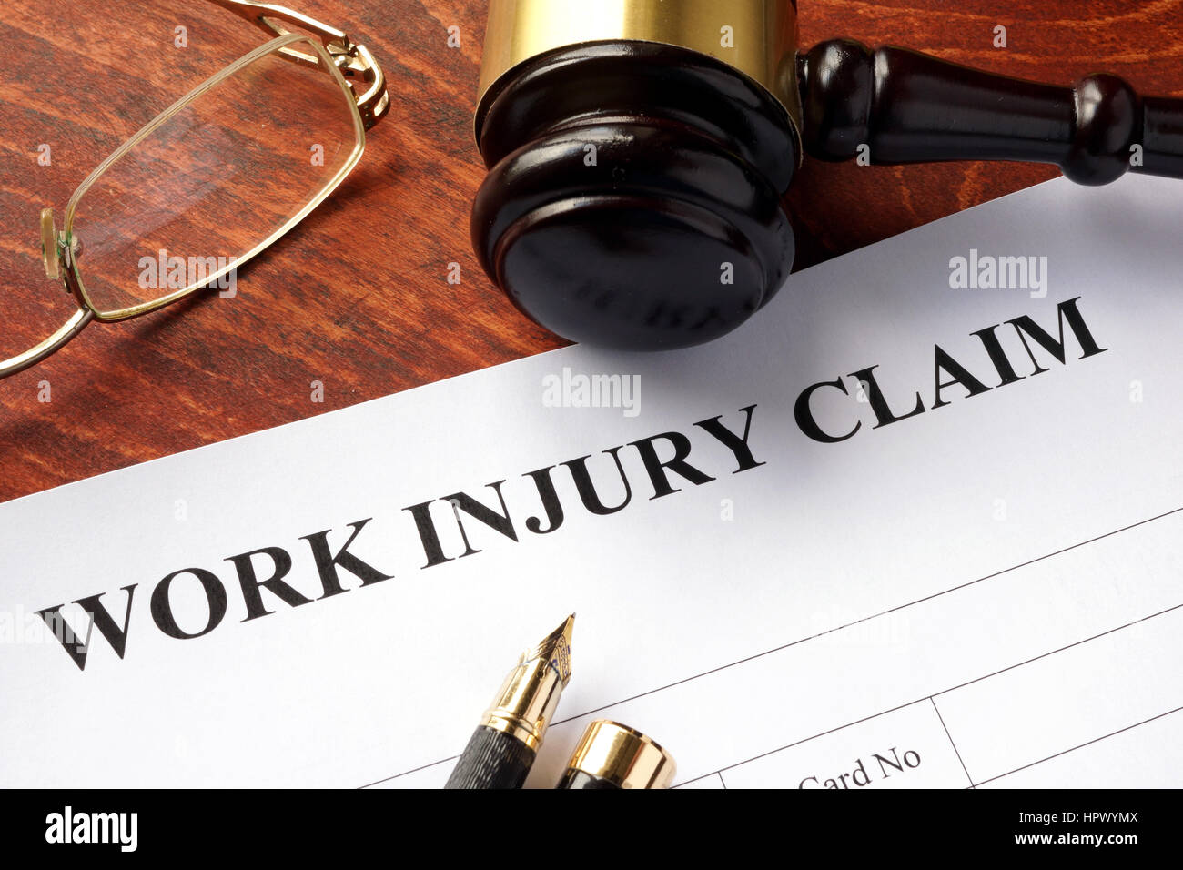 Worker compensation. Work injury claim on a table Stock Photo - Alamy