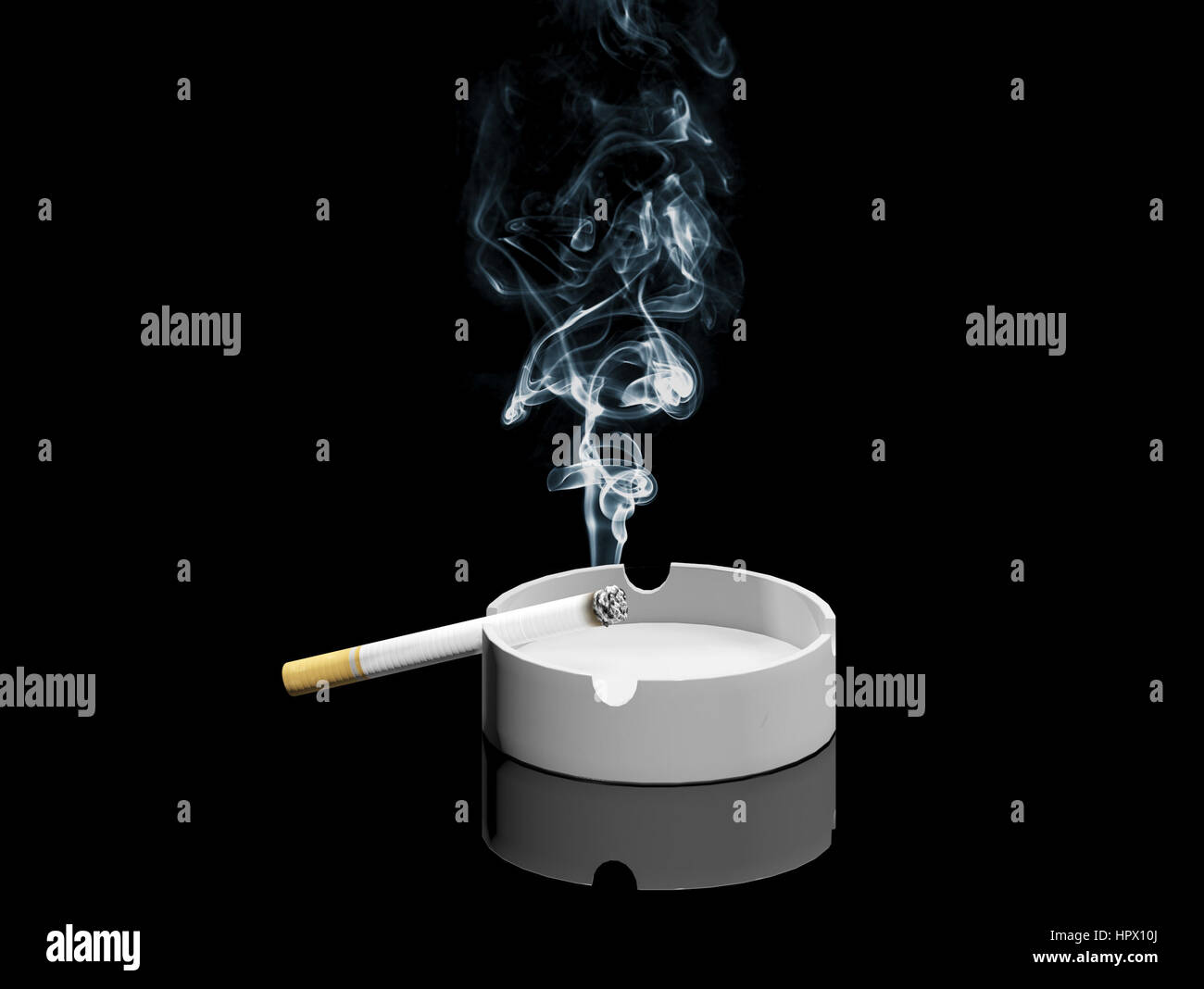 Cigarette and smoke on ashtray isolated on dark background Stock Photo ...