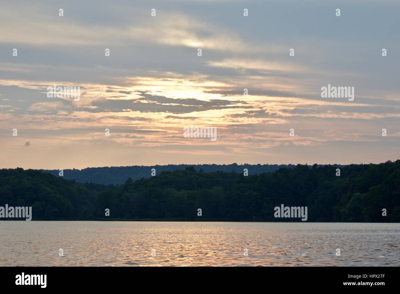 Beautiful isolated photo of a sunset on the lake Stock Photo - Alamy