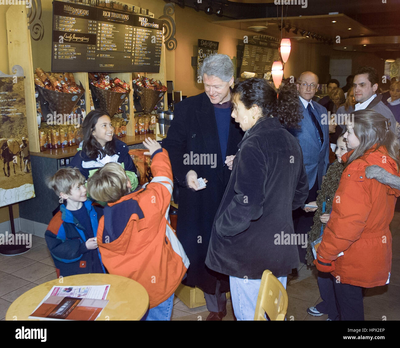 President Bill Clinton with customers at a Starbucks coffee shop in ...