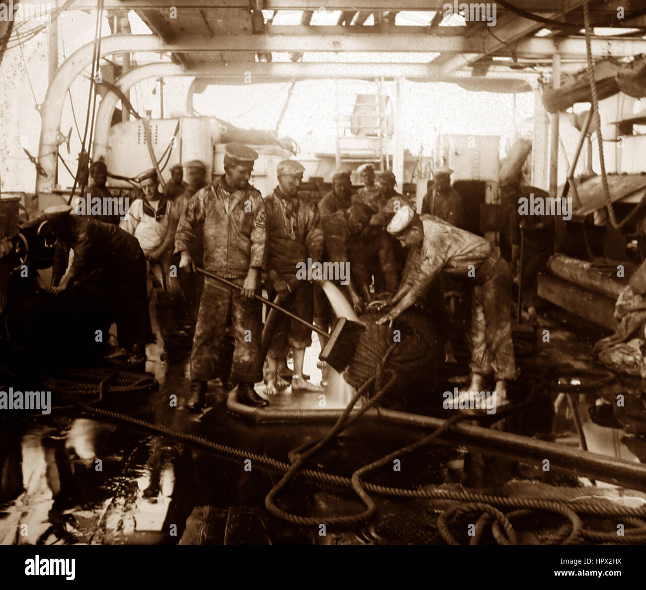 Royal Navy sailors tarring rope - Victorian period Stock Photo - Alamy