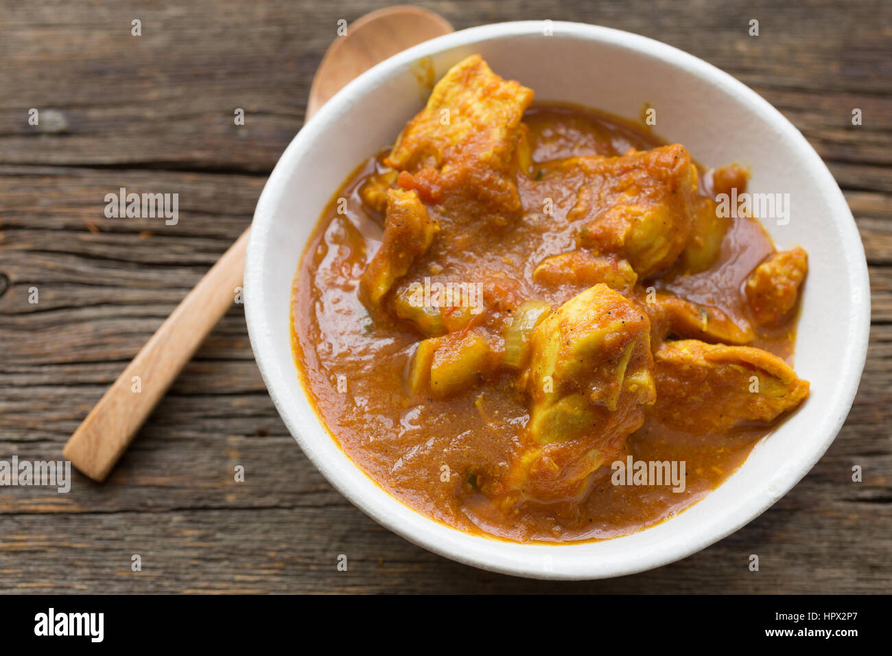 A dish of chicken tikka masala with turmeric and garam masala spices ...