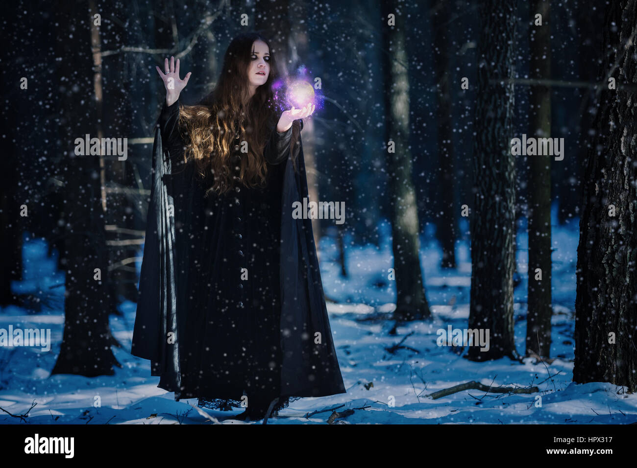 Enchantress at the magic bullet in the enchanted forest Stock Photo - Alamy