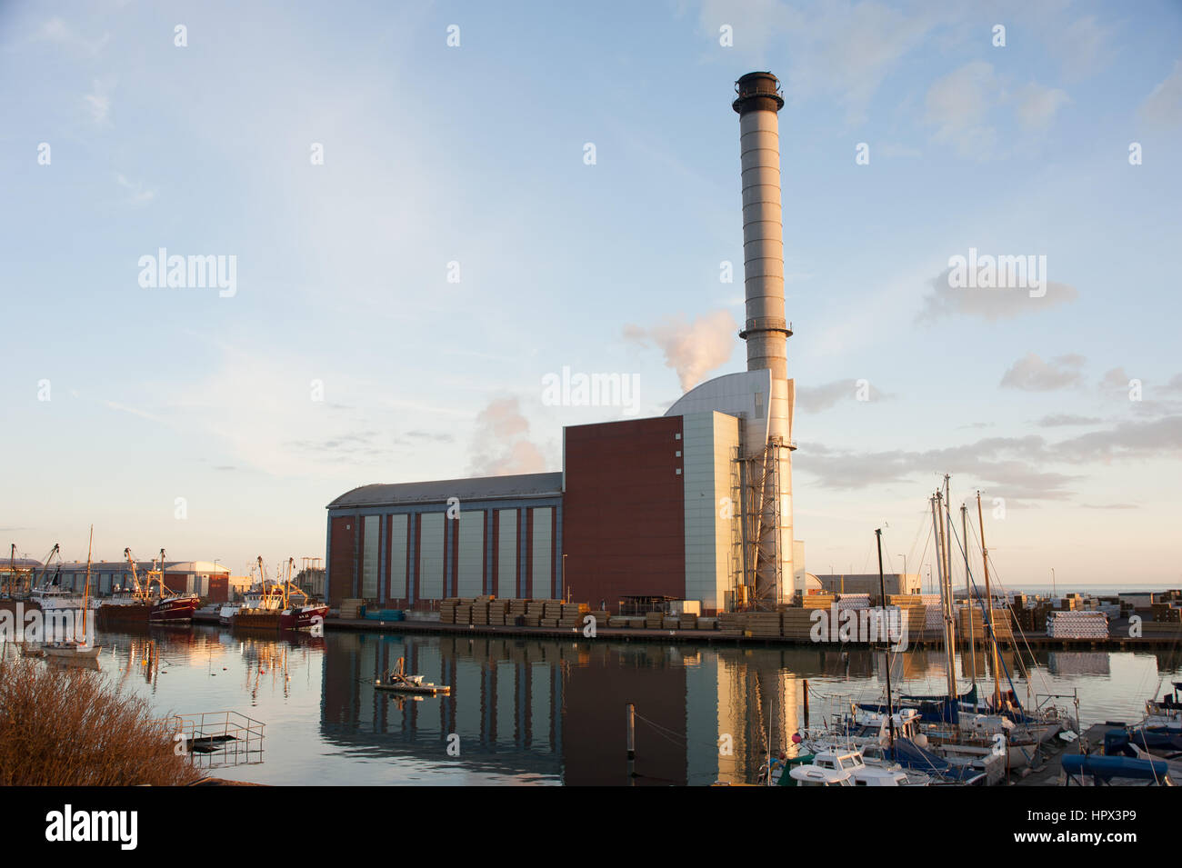 Shoreham power station and reflection in still water, with vapour ...