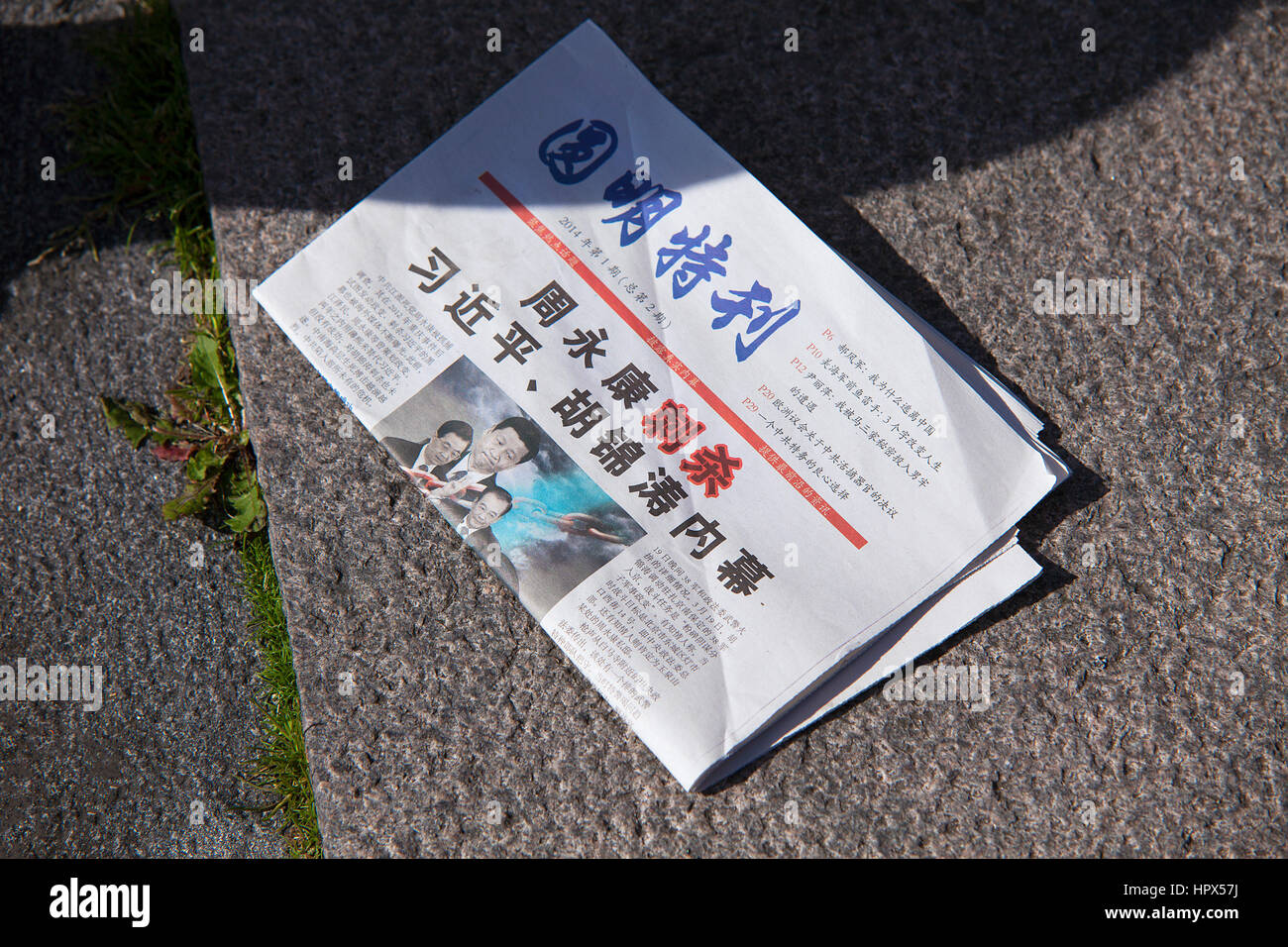 Asian newspaper laying on the ground Stock Photo - Alamy
